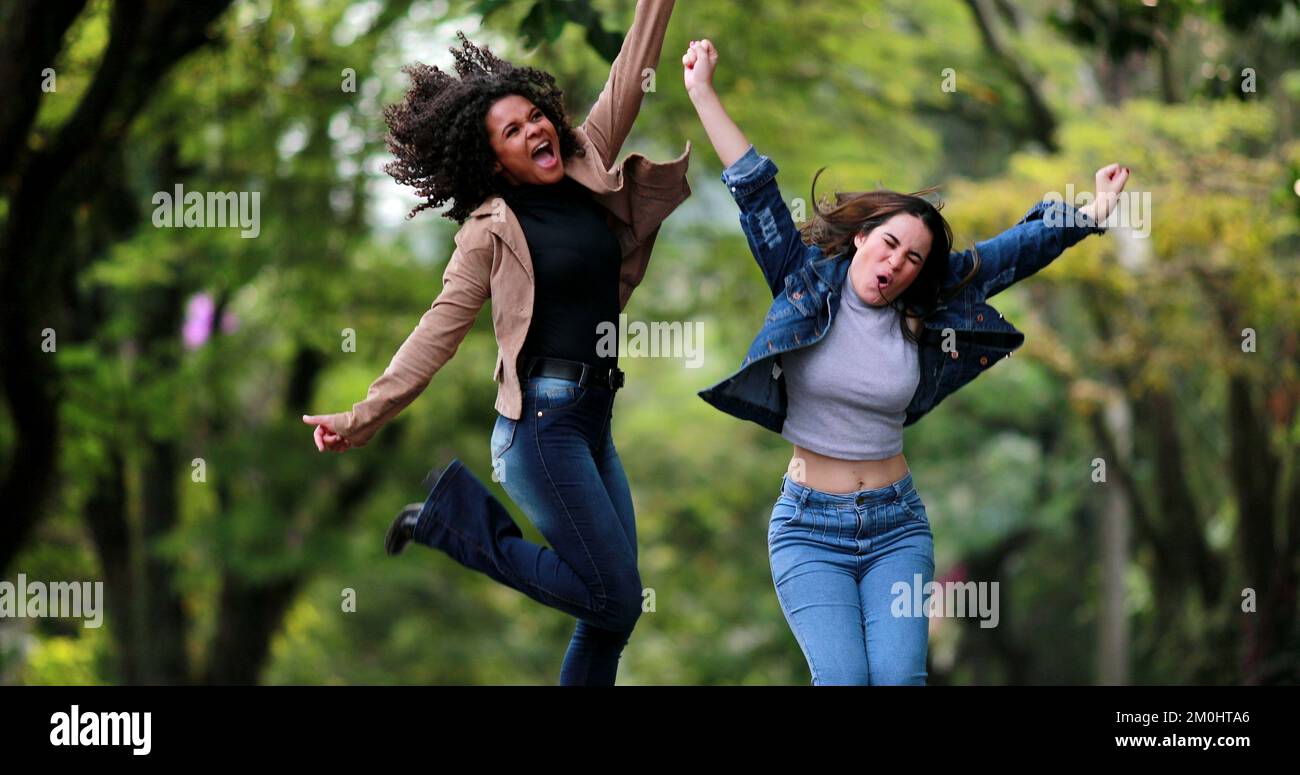 Happy diverse women jump in the air in celebration Stock Photo - Alamy