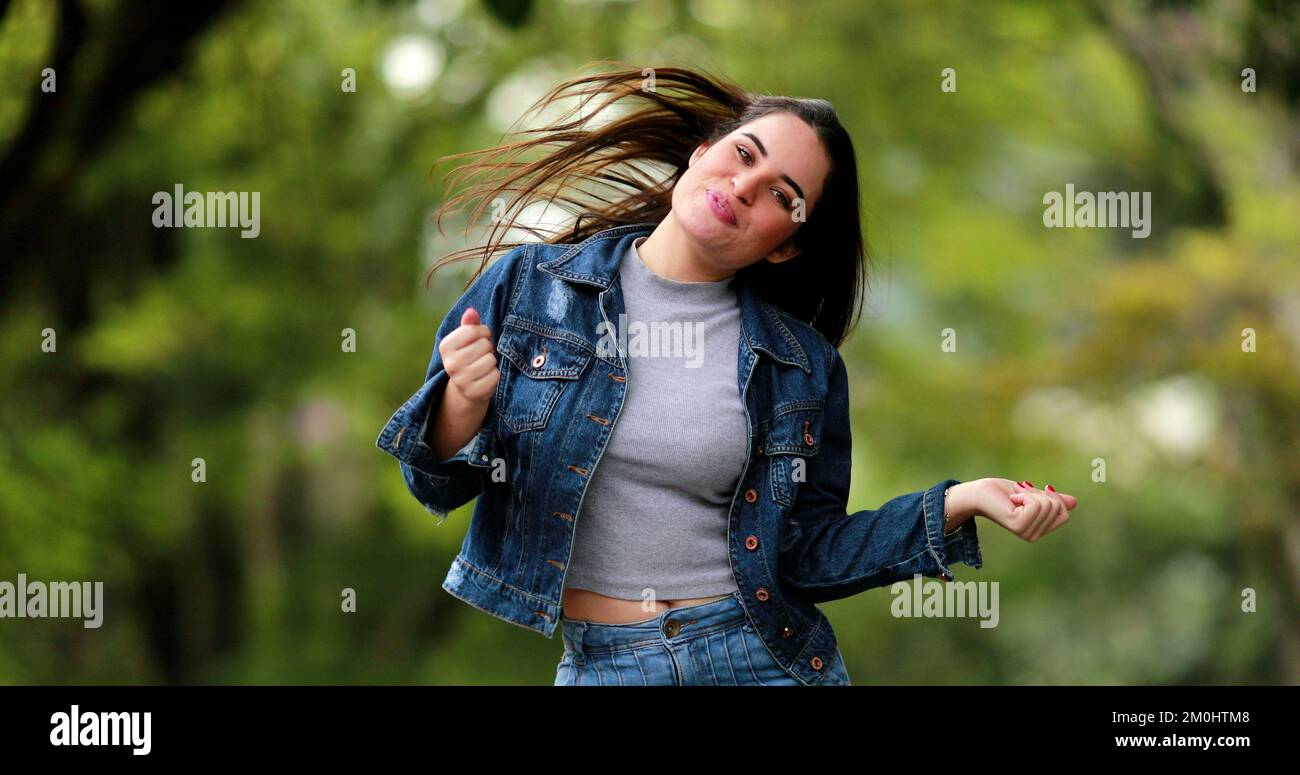 Fun excited happy young woman dancing with joy outside in nature Stock ...