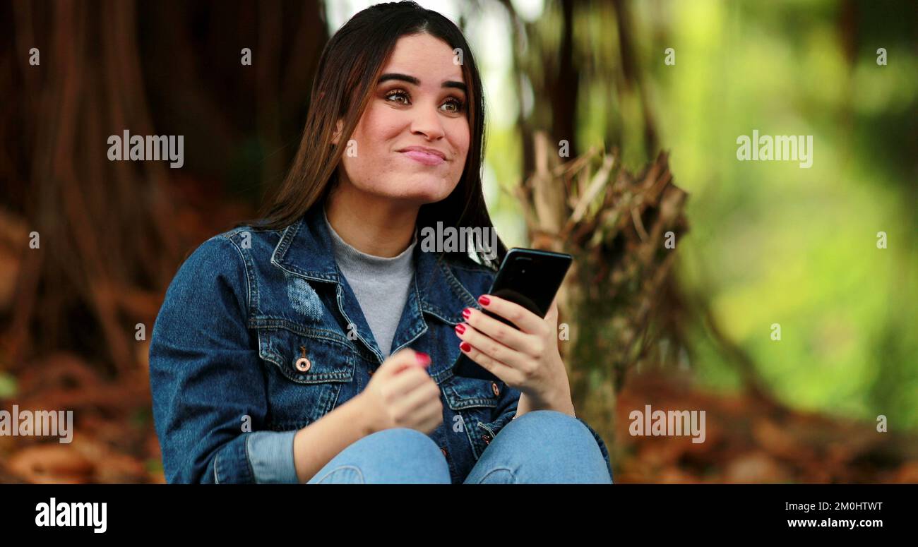 Diverse girls looking at cellphone screen. Woman calling friend to ...