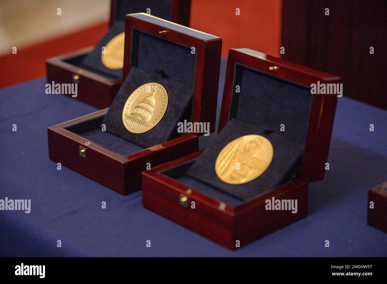 Members of the United States Congress hold a Congressional Gold Medal ...