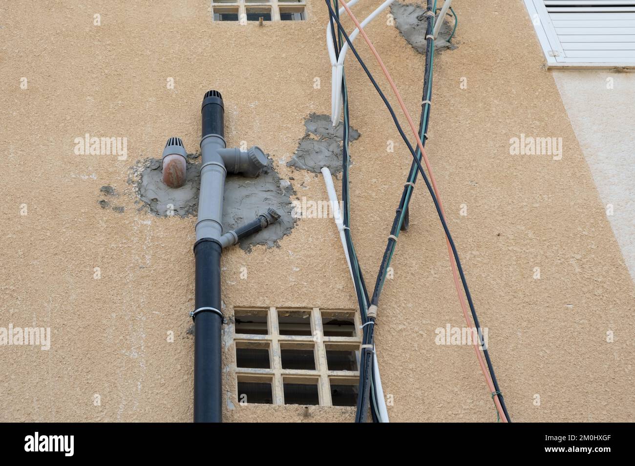 Plumbing installation of water pipe and sewerage system on the building ...