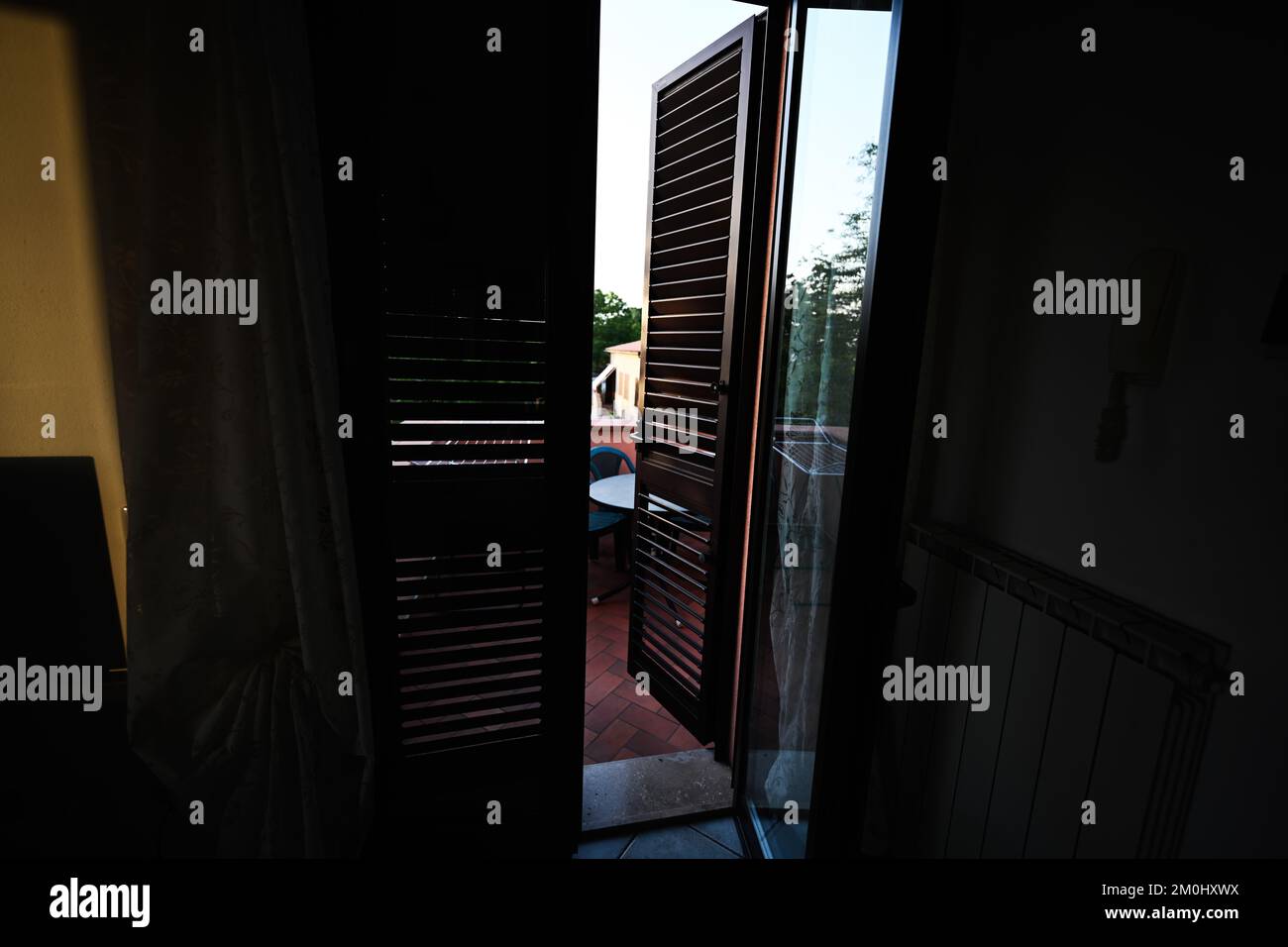 Window with blinds of terrace or balcony Stock Photo - Alamy
