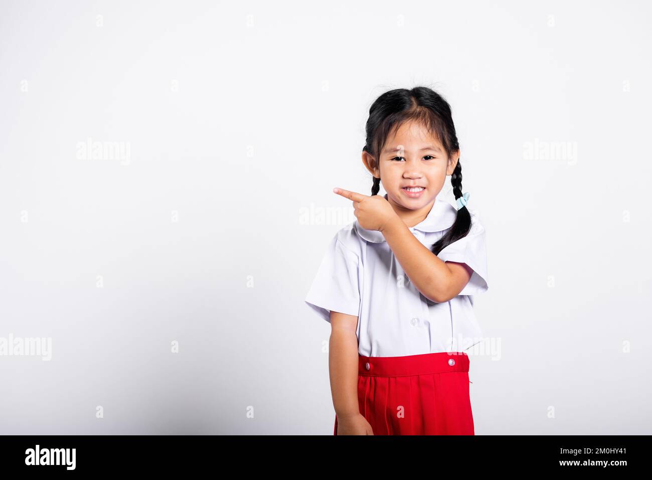 Asian toddler smiling happy wear student thai uniform red skirt keeps ...