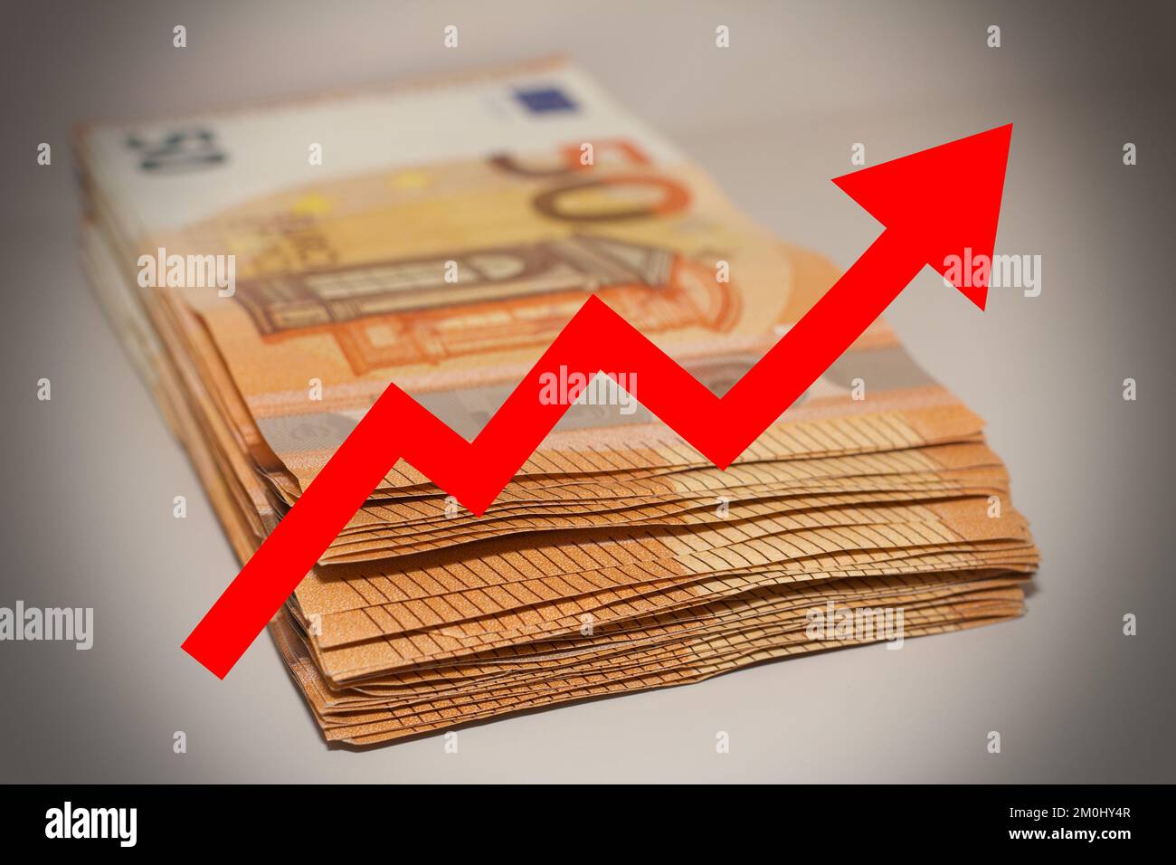 Stack of 50 euros with a red arrow, concept of price increase Stock ...