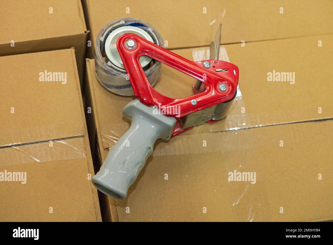 Packing Tape Dispenser Gun Device at Cardboard Boxes Warehouse Stock ...