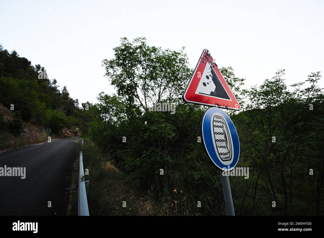 Road sign falling stones, traffic sign caution possible falling rocks ...