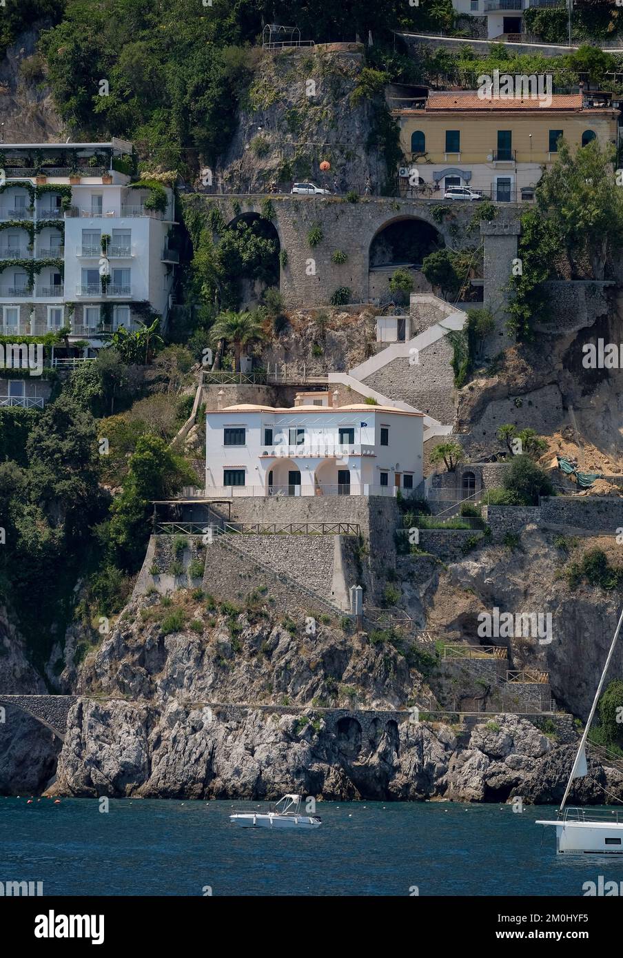Houses on the Amalfi coast cliffside with stairs leading down to the ...
