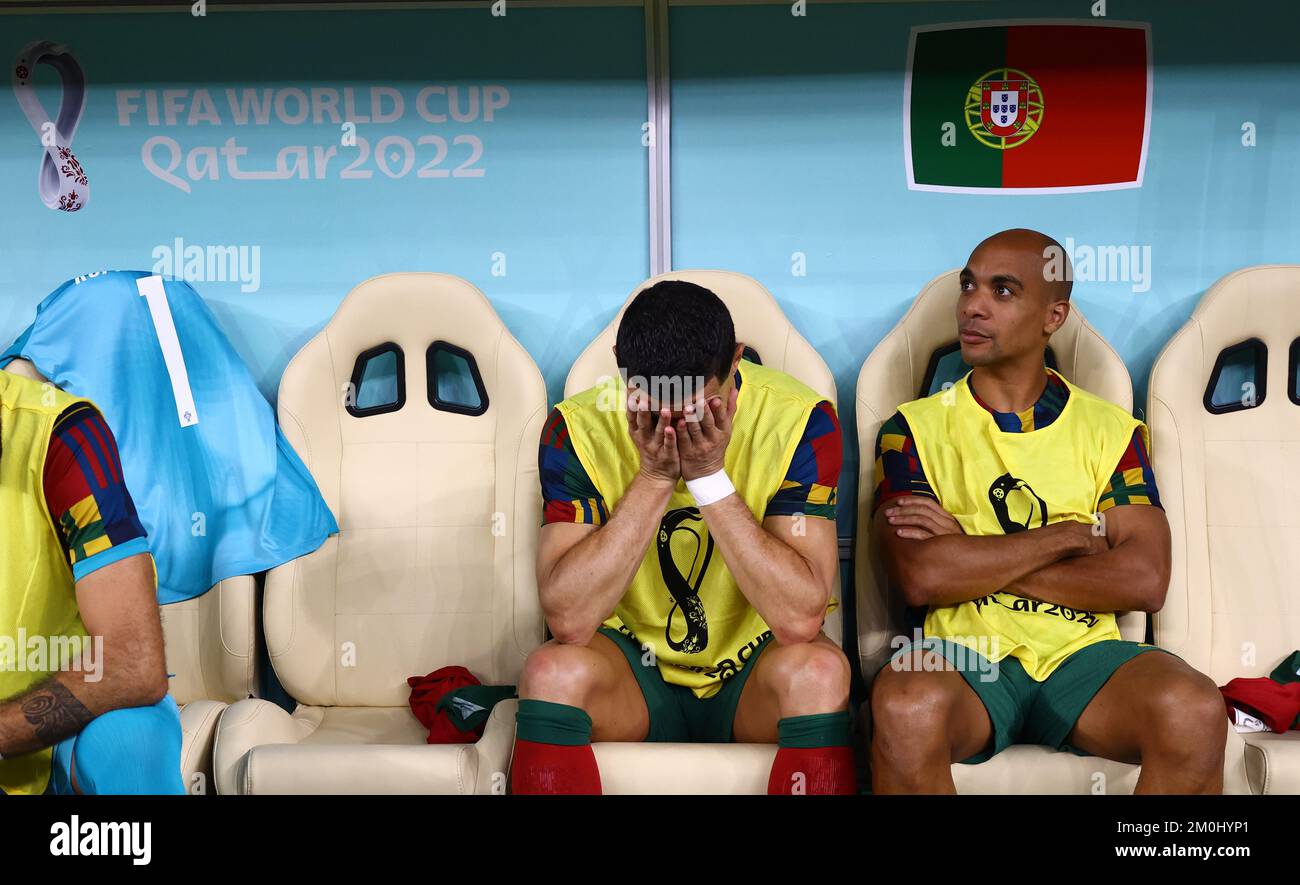 Doha, Qatar, 6th December 2022. Cristiano Ronaldo of Portugal sits on the bench with his head in ...