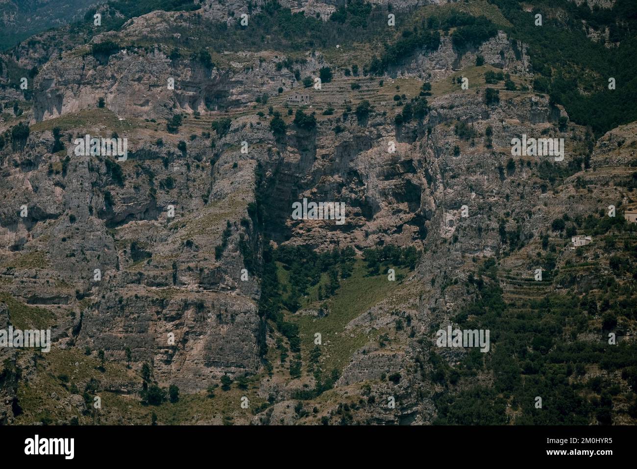 A shot of the side of a limestone cliff on the Amalfi coast showing the ...