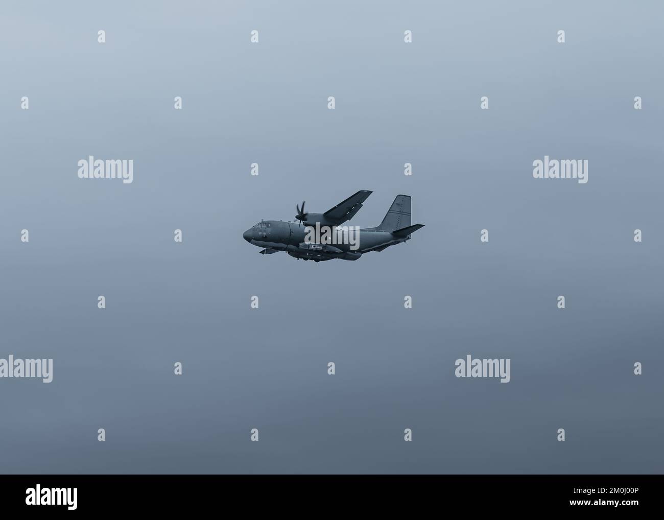 A huge military plane flying in the sky Stock Photo - Alamy