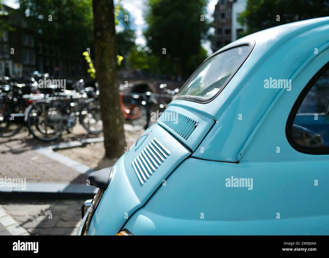 The details on a blue classic car Fiat 500 near a canal in Amsterdam ...