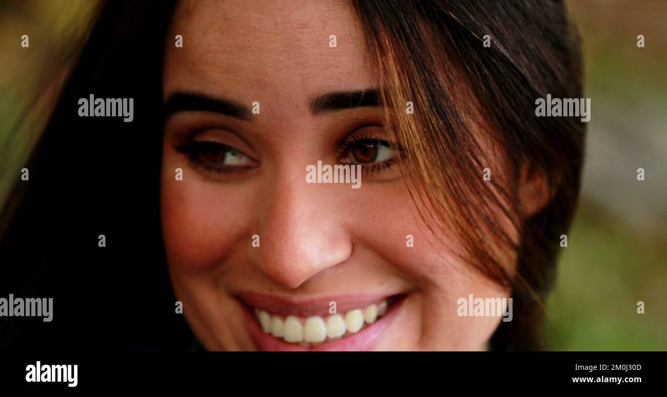 Millennial teen woman adjusting hair Stock Photo - Alamy