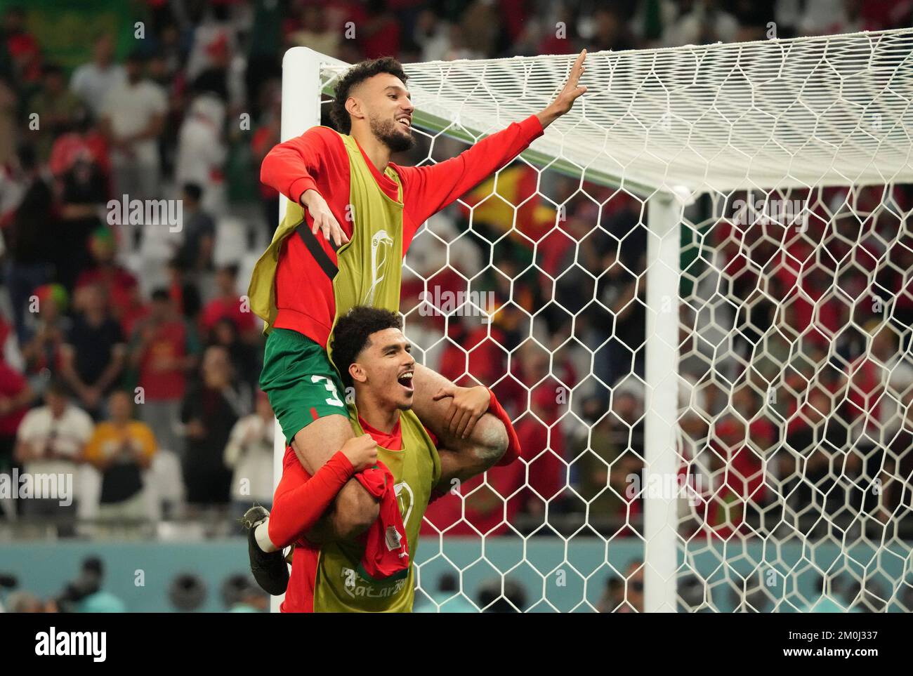Al Rayyan, Qatar. 6th Dec, 2022. Noussair Mazraoui (top) of Morocco ...