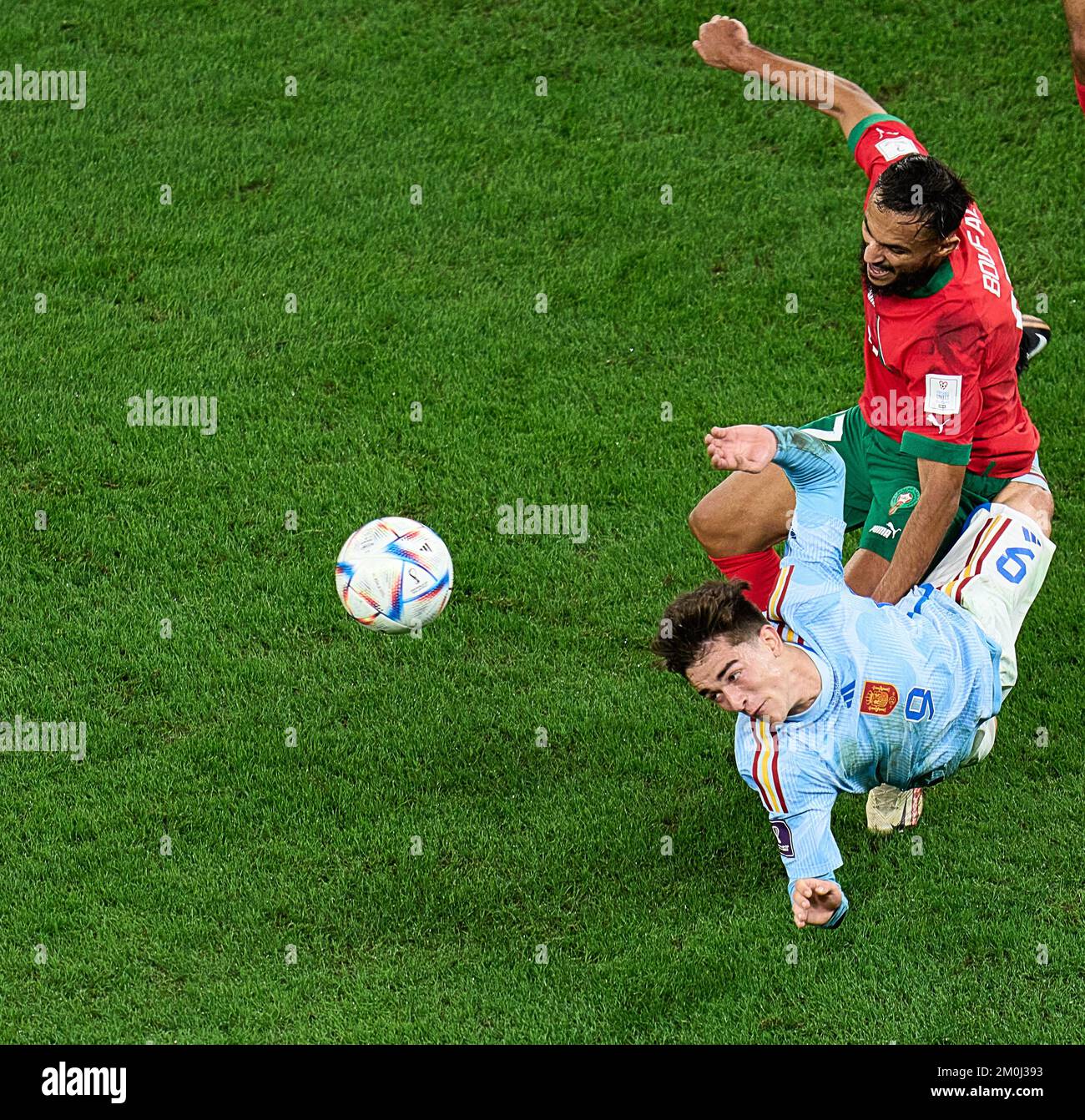 Al Rayyan, Qatar. 6th Dec, 2022. Gavi (bottom) of Spain vies with ...