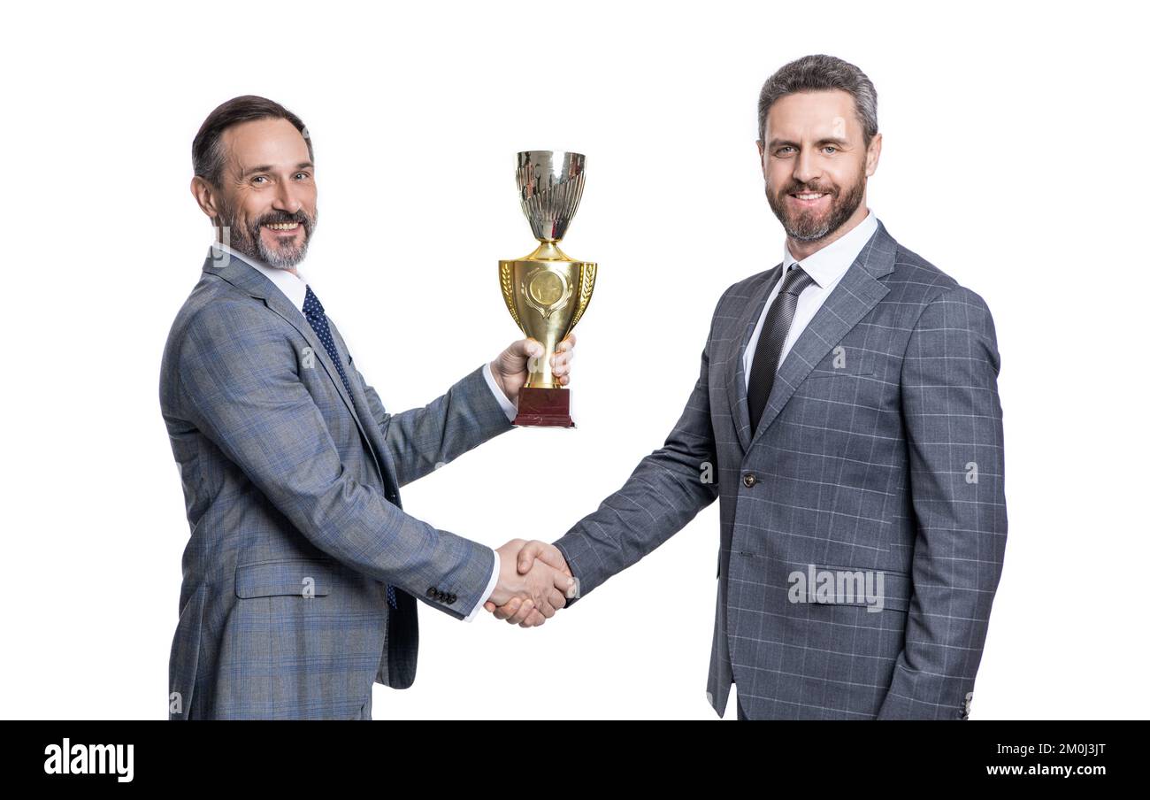 businessmen celebrate award with handshake. photo of businessmen ...