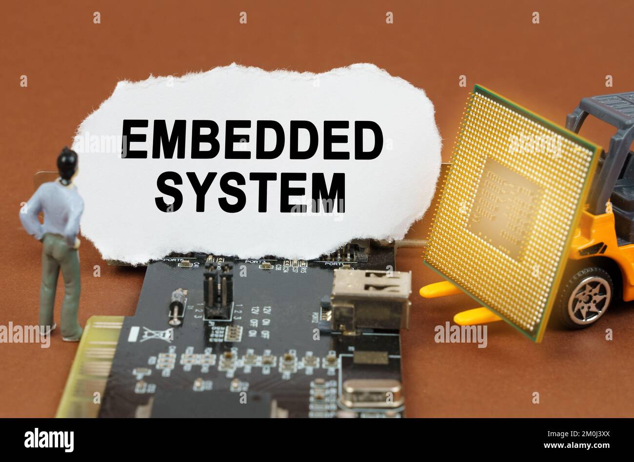 Computer concept. On the board with microcircuits lies a paper plate ...