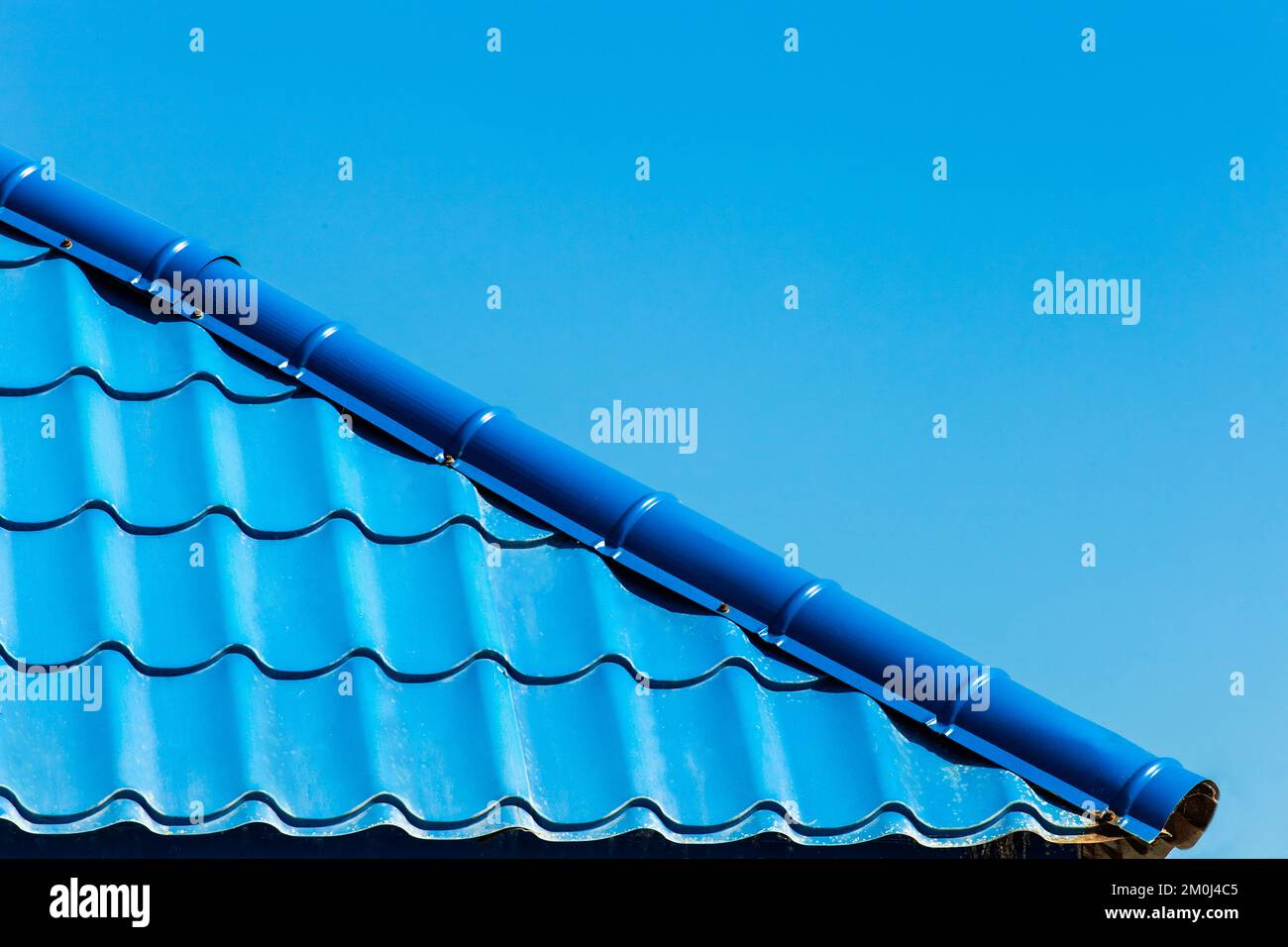 Traditional style facade of structure with blue tiled roof hi-res stock ...