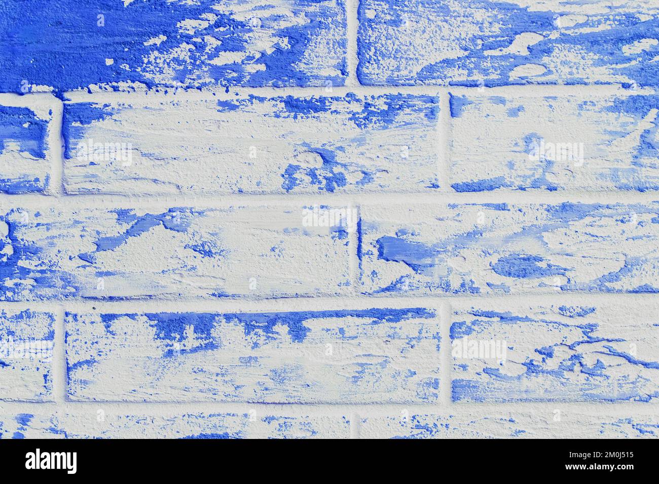 Light white brick wall with blue decorative paint patterns texture ...