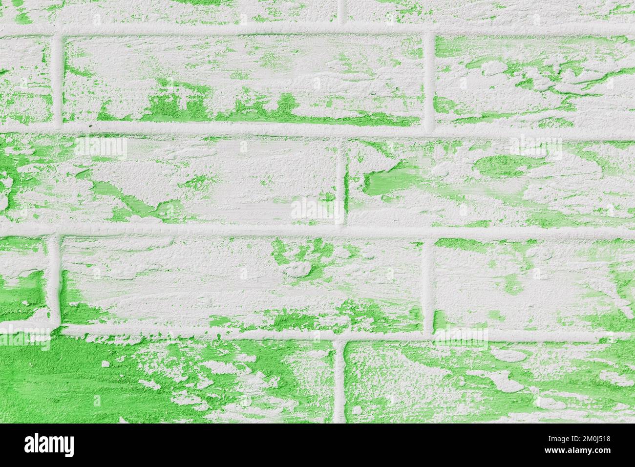 Light white brick wall with green decorative paint patterns texture ...