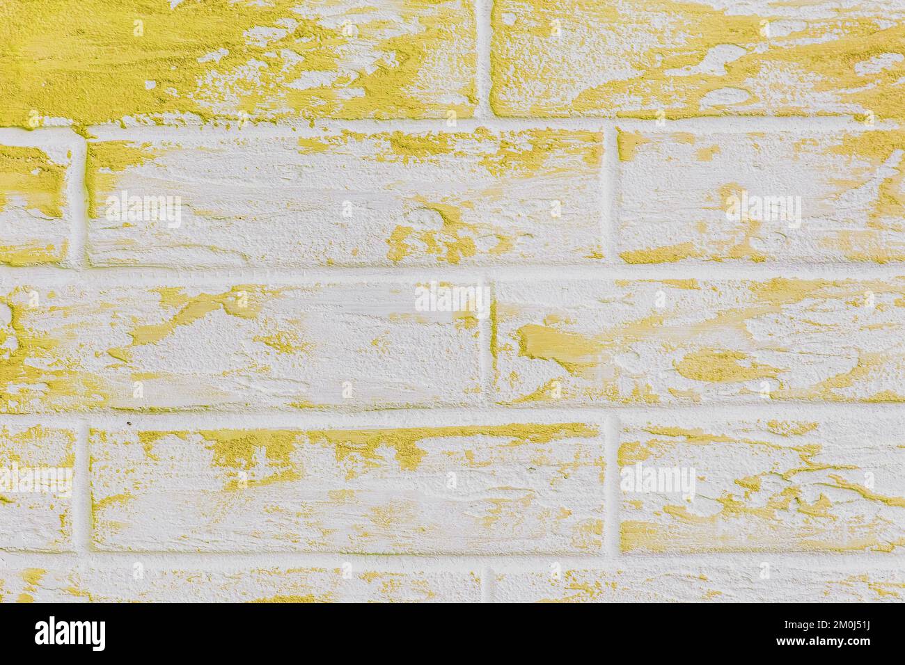 Light white brick wall with yellow decorative paint patterns texture ...