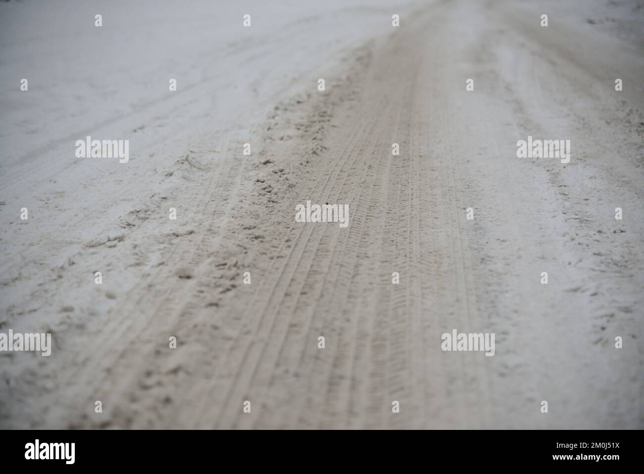 Wheel tracks on the winter road covered with snow Stock Photo - Alamy