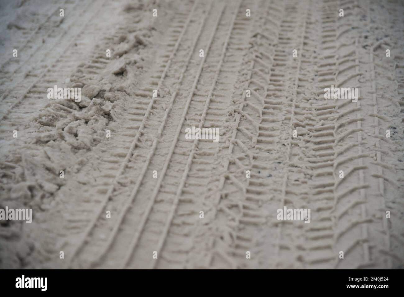 Snow tyre mark. Asphalt covered in snow. Dangerous road conditions. Car ...