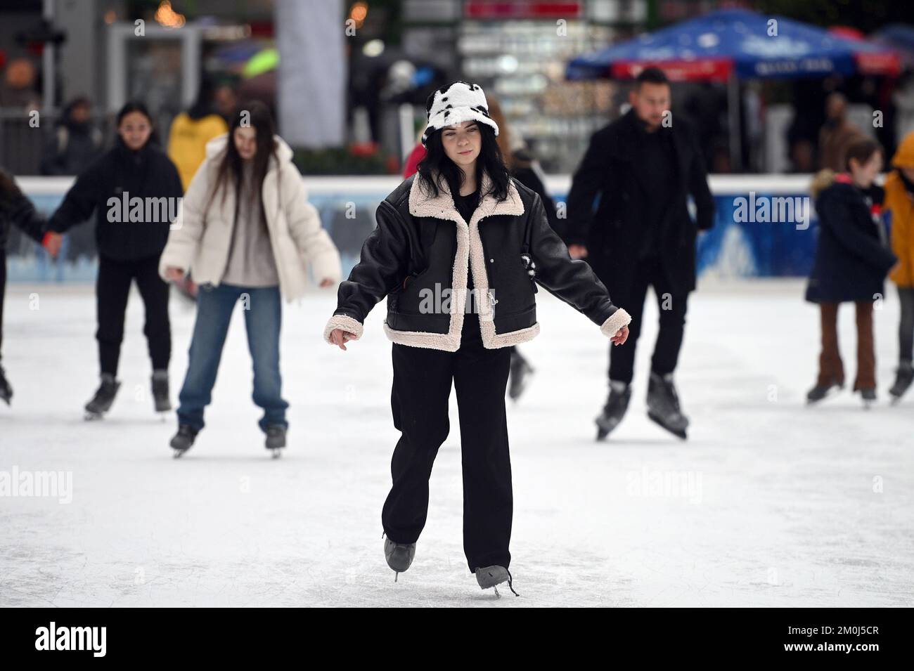 People take the ice at the Bank of America Winter Village at Bryant ...