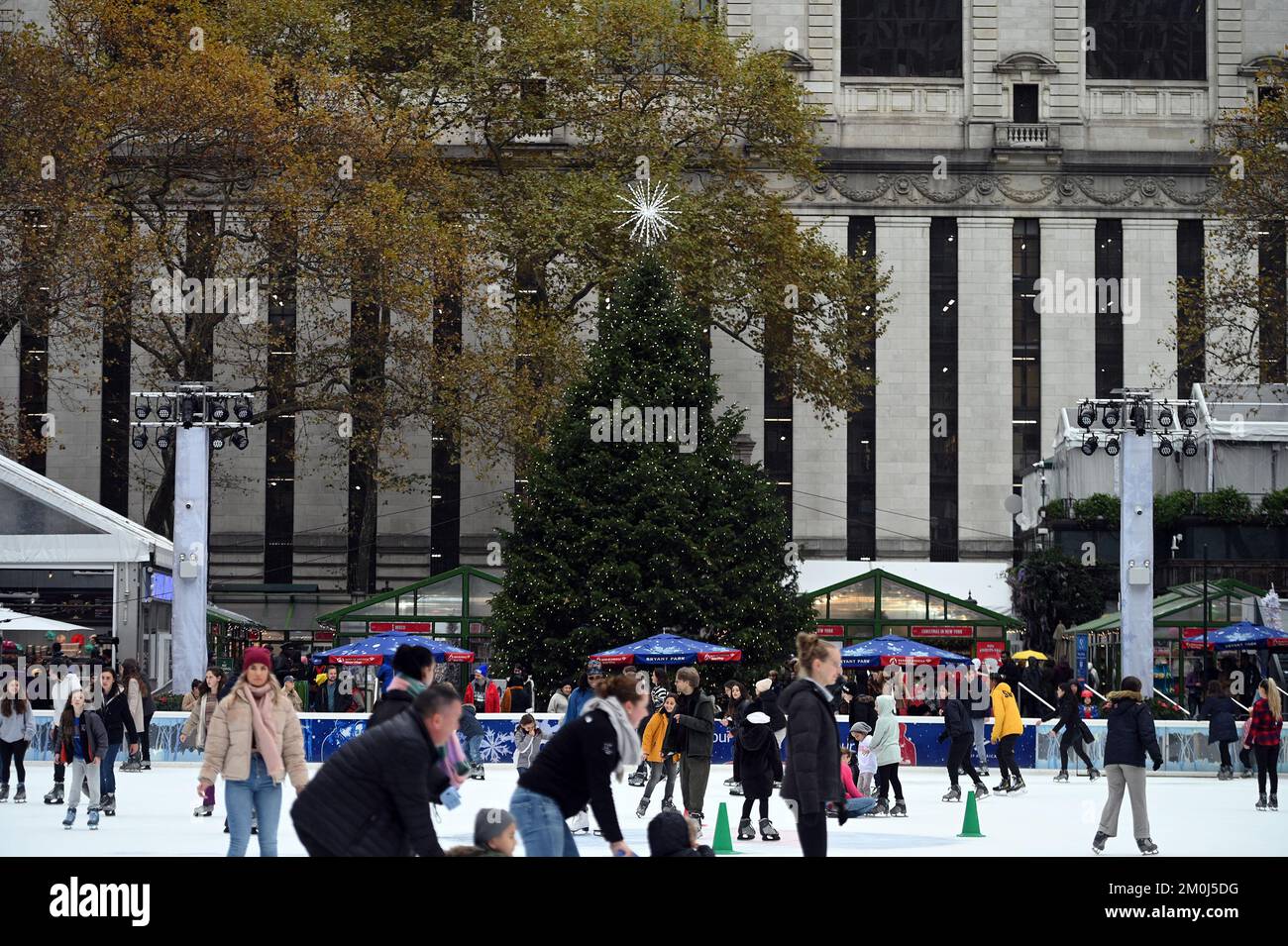 People take the ice at the Bank of America Winter Village at Bryant ...