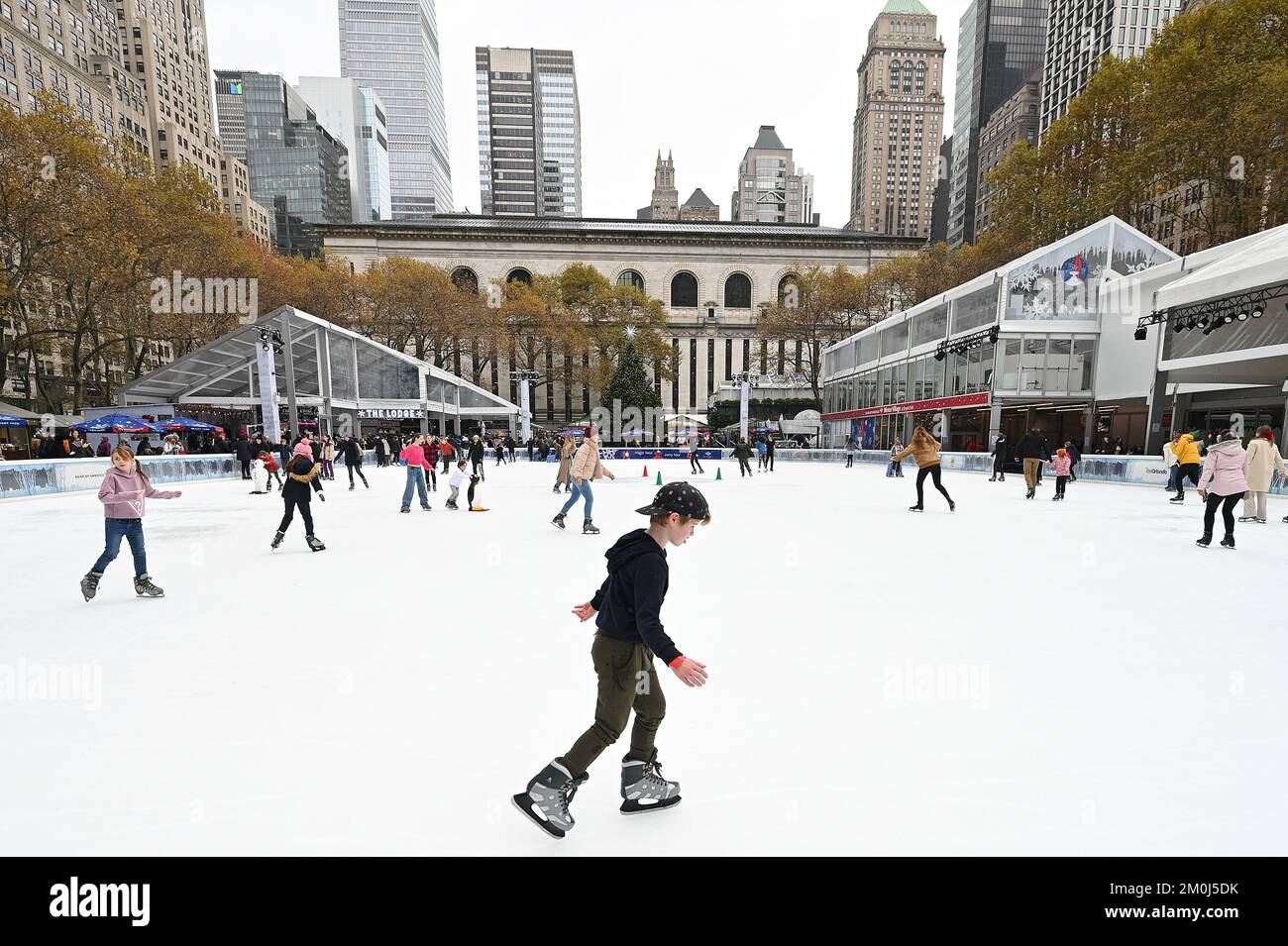 People take the ice at the Bank of America Winter Village at Bryant ...