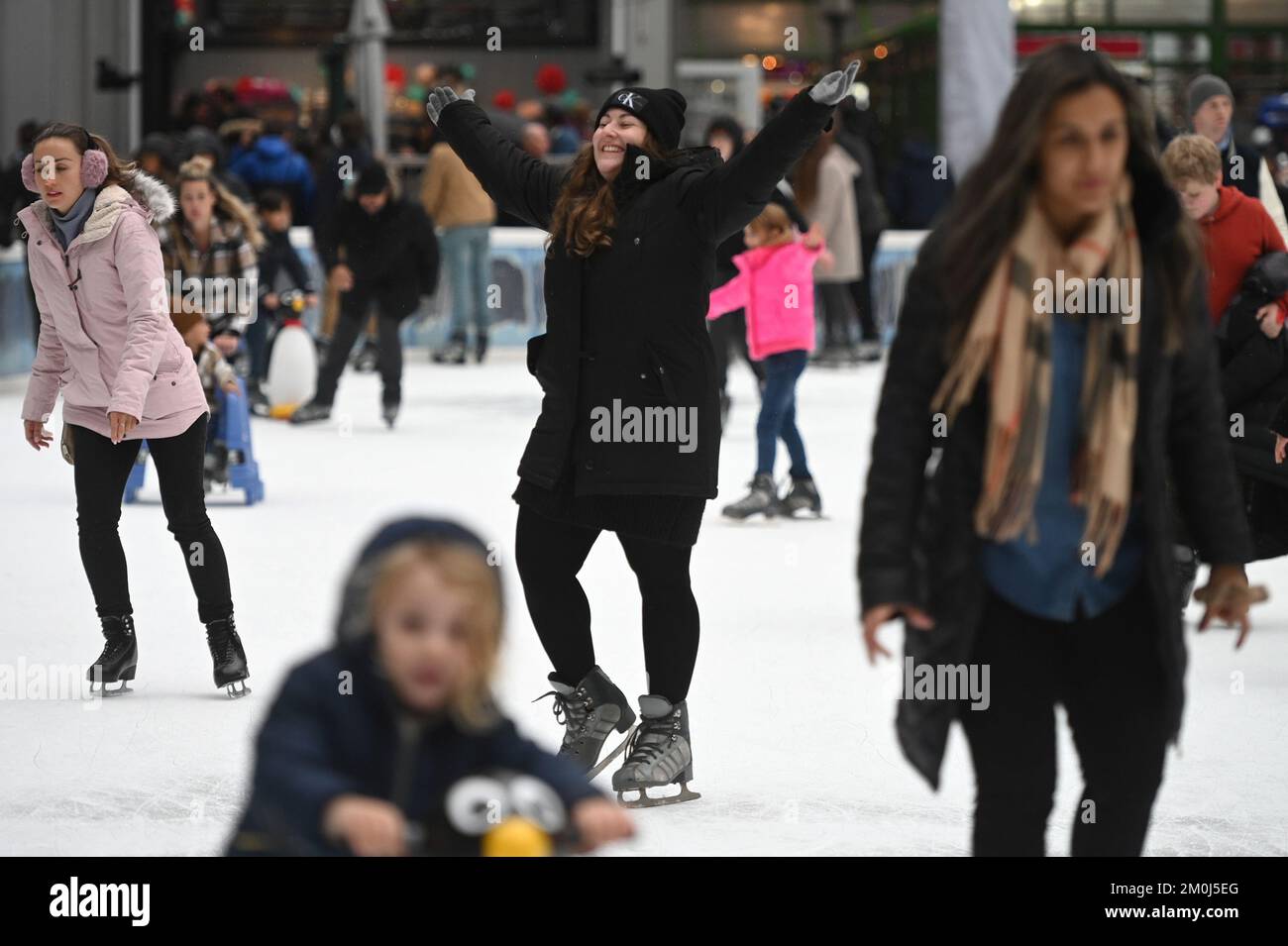People take the ice at the Bank of America Winter Village at Bryant ...