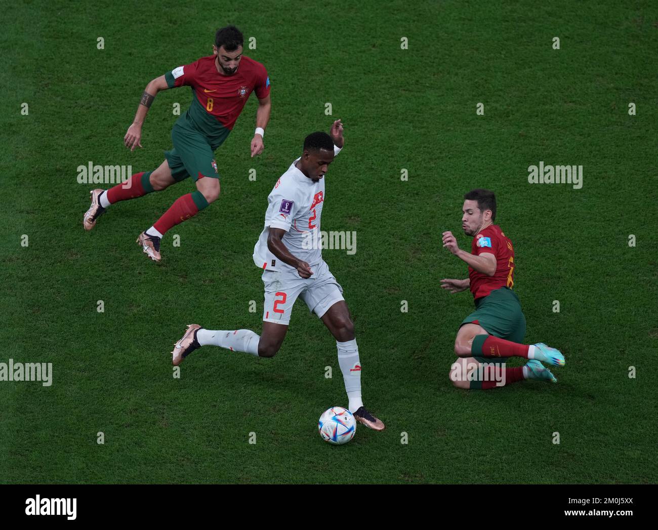 Portugal's Bruno Fernandes (left) and Raphael Guerreiro (right) battle ...