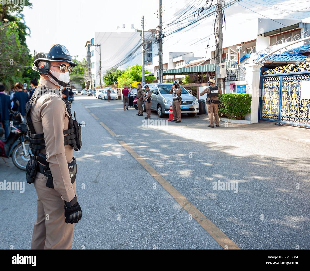 Thai police officers stand on guard as activists from "Chiang Mai ...