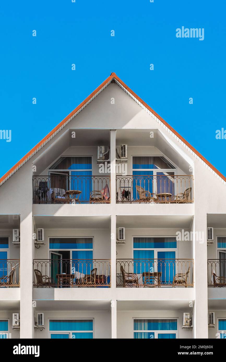 Triangular facade of a modern building interior, a hotel exterior ...