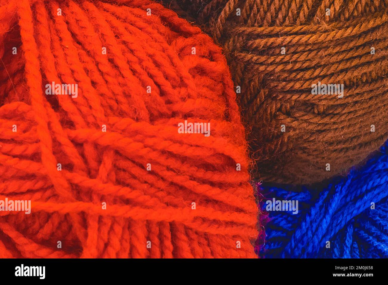 Heap of colored fabric balls of thread textile yarn background, close ...