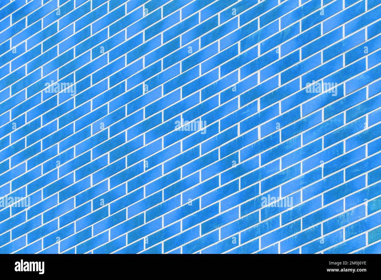 Diagonal, geometric modern blue navy paint brick wall building facade ...