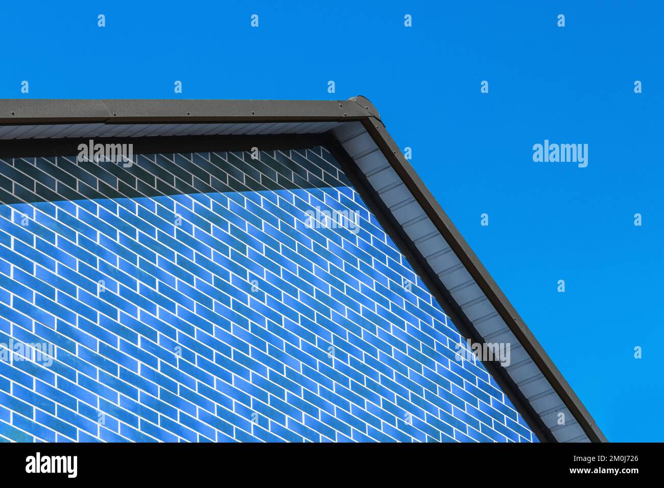 Modern house facade home exterior with blue brick wall interior against ...