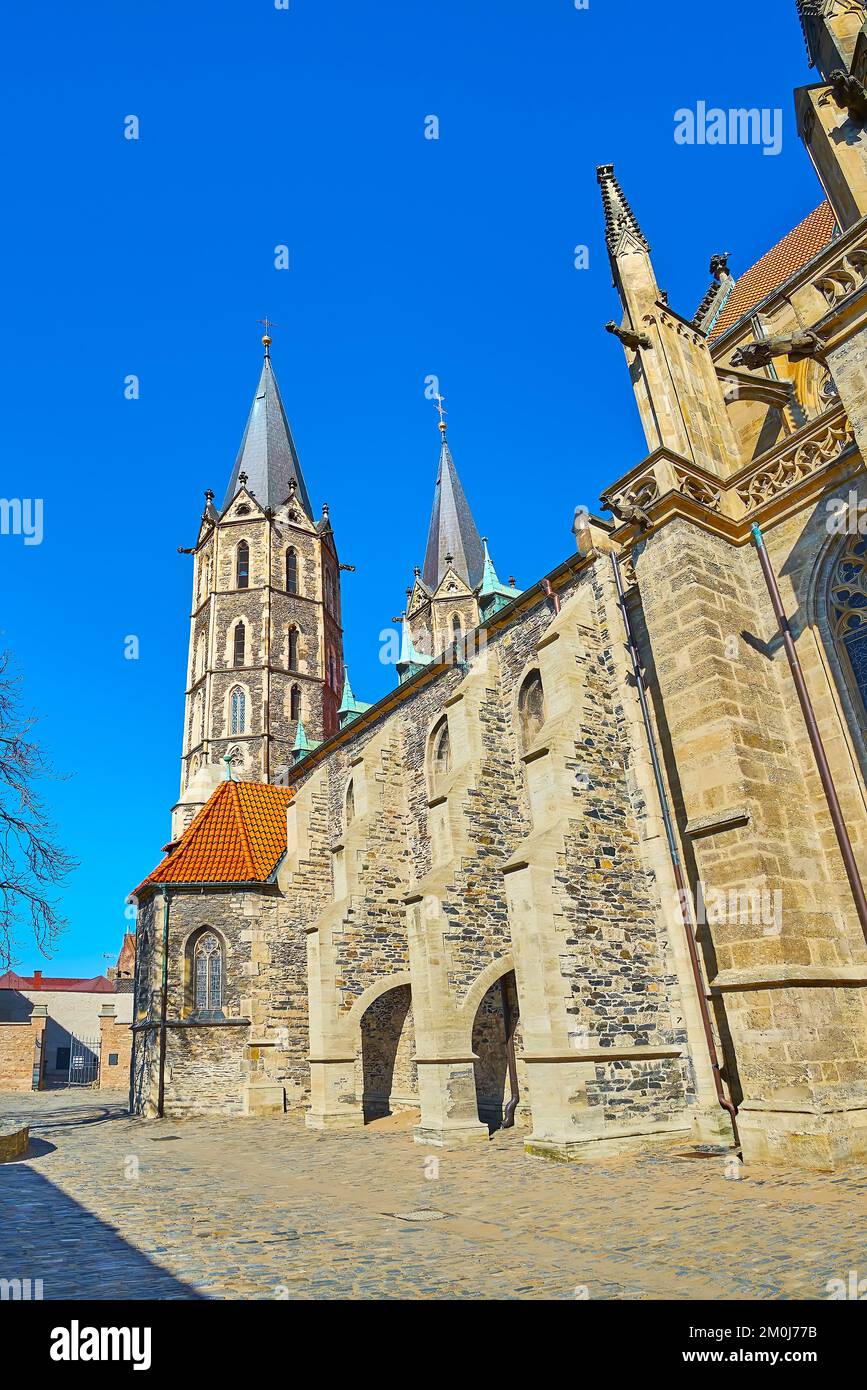 Historic St Bartholomew Parish Church side wall with buttresses and a ...