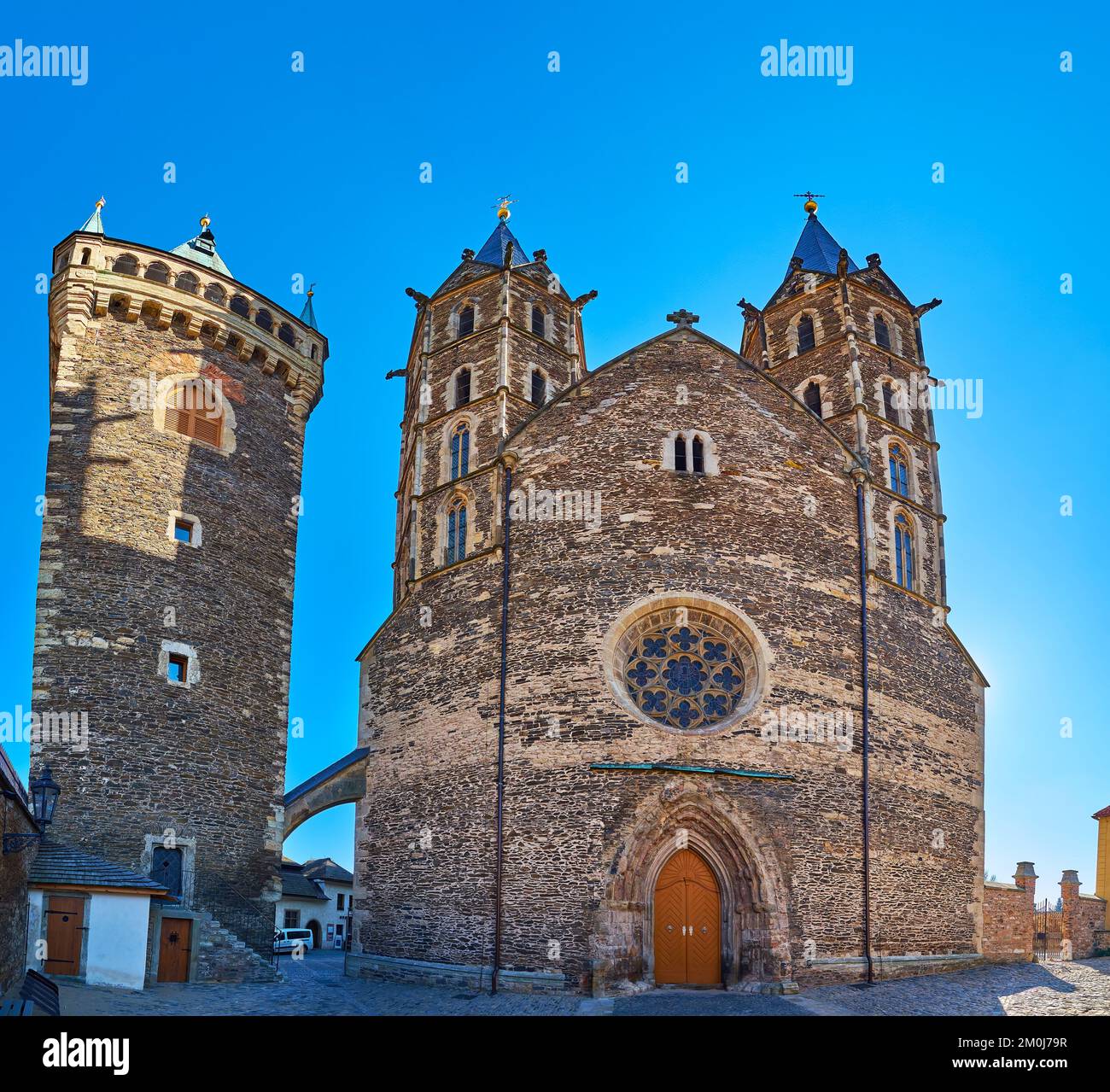 The stone facade of historic Gothic St Bartholomew Parish Church with ...