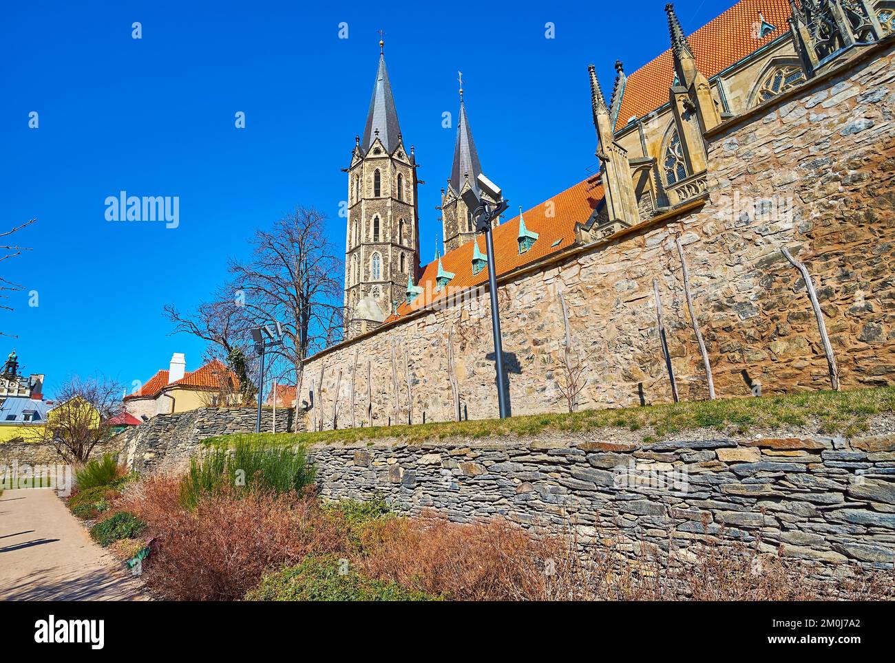 The slender Gothic bell towers of medieval stone St Bartholomew Church ...