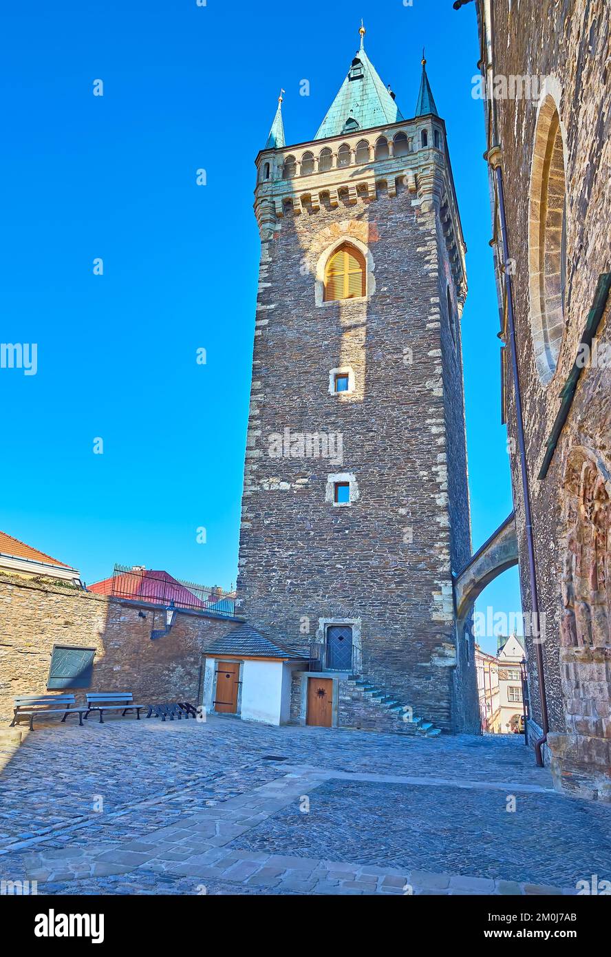The medieval stone belfry and St Bartholomew Church are connected with ...