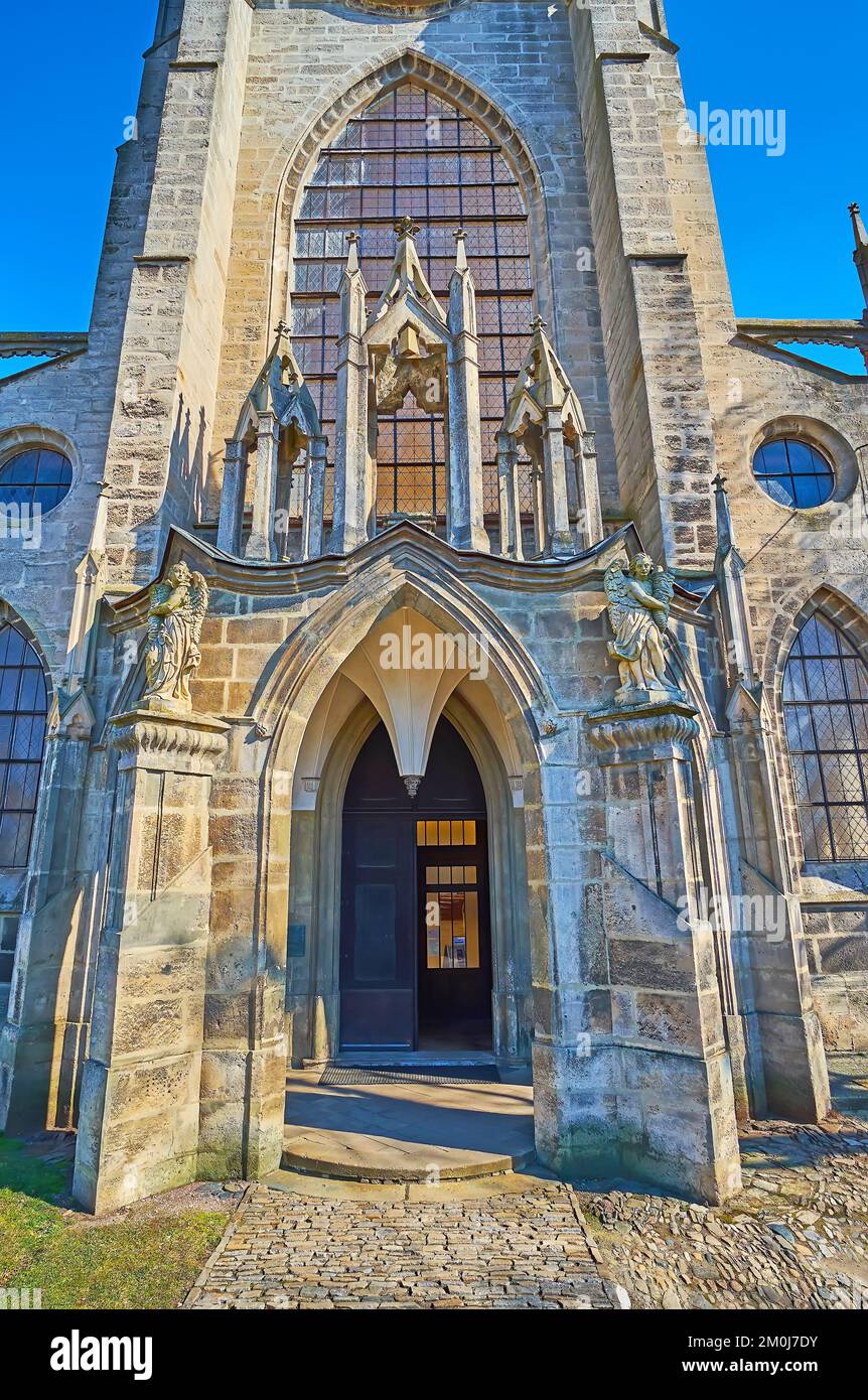 The carved stone entrance gate of Sedlec Cathedral with decorative ...