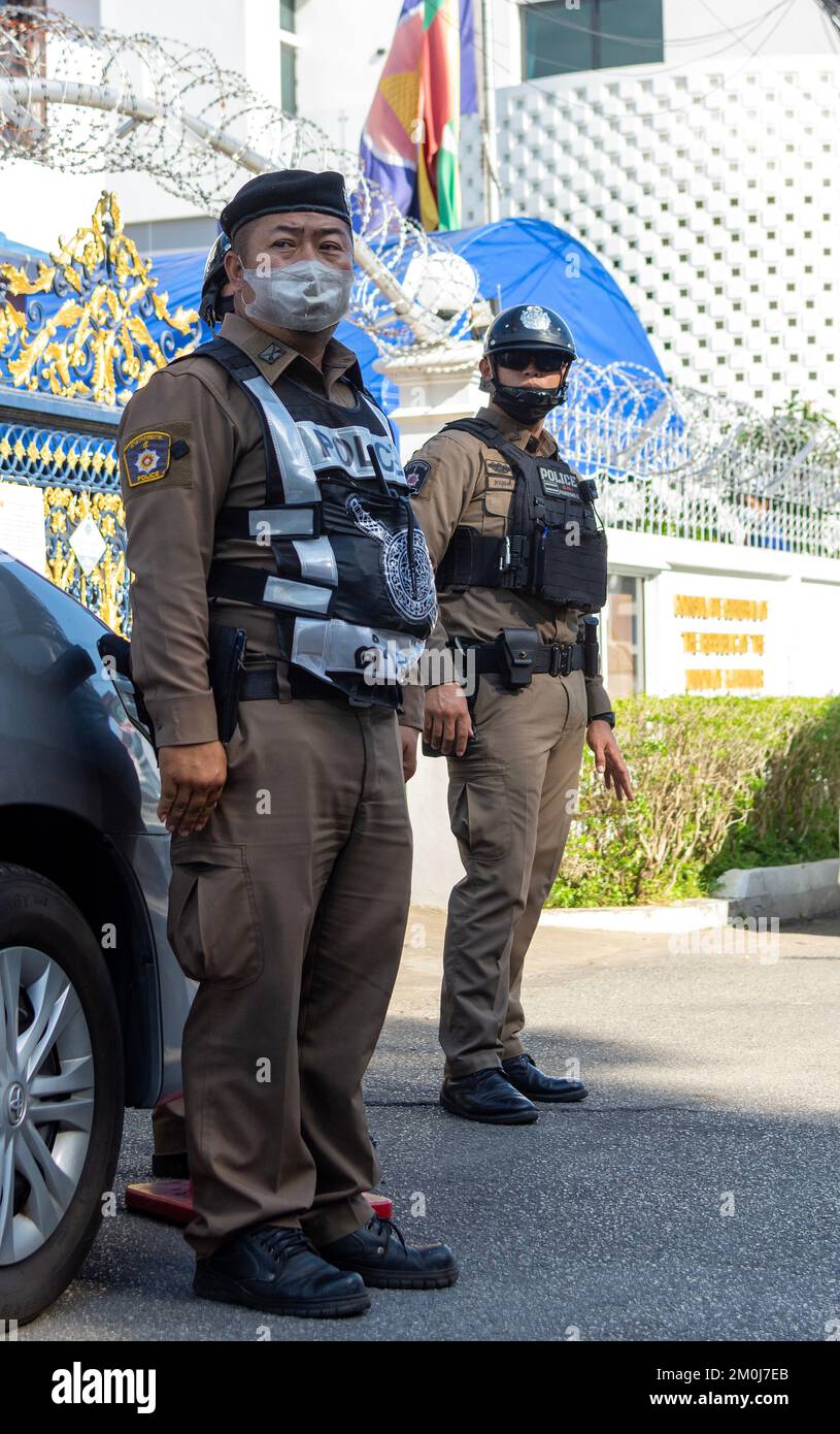 Thai police officers stand on guard as activists from "Chiang Mai ...