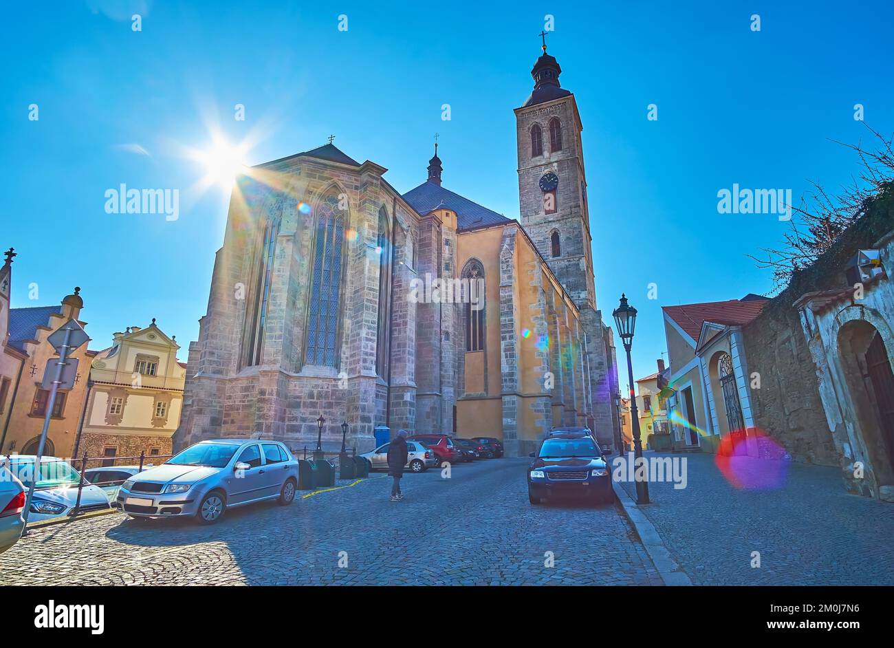 The bright sun shines over Havlickovo Square with medieval stone Gothic ...