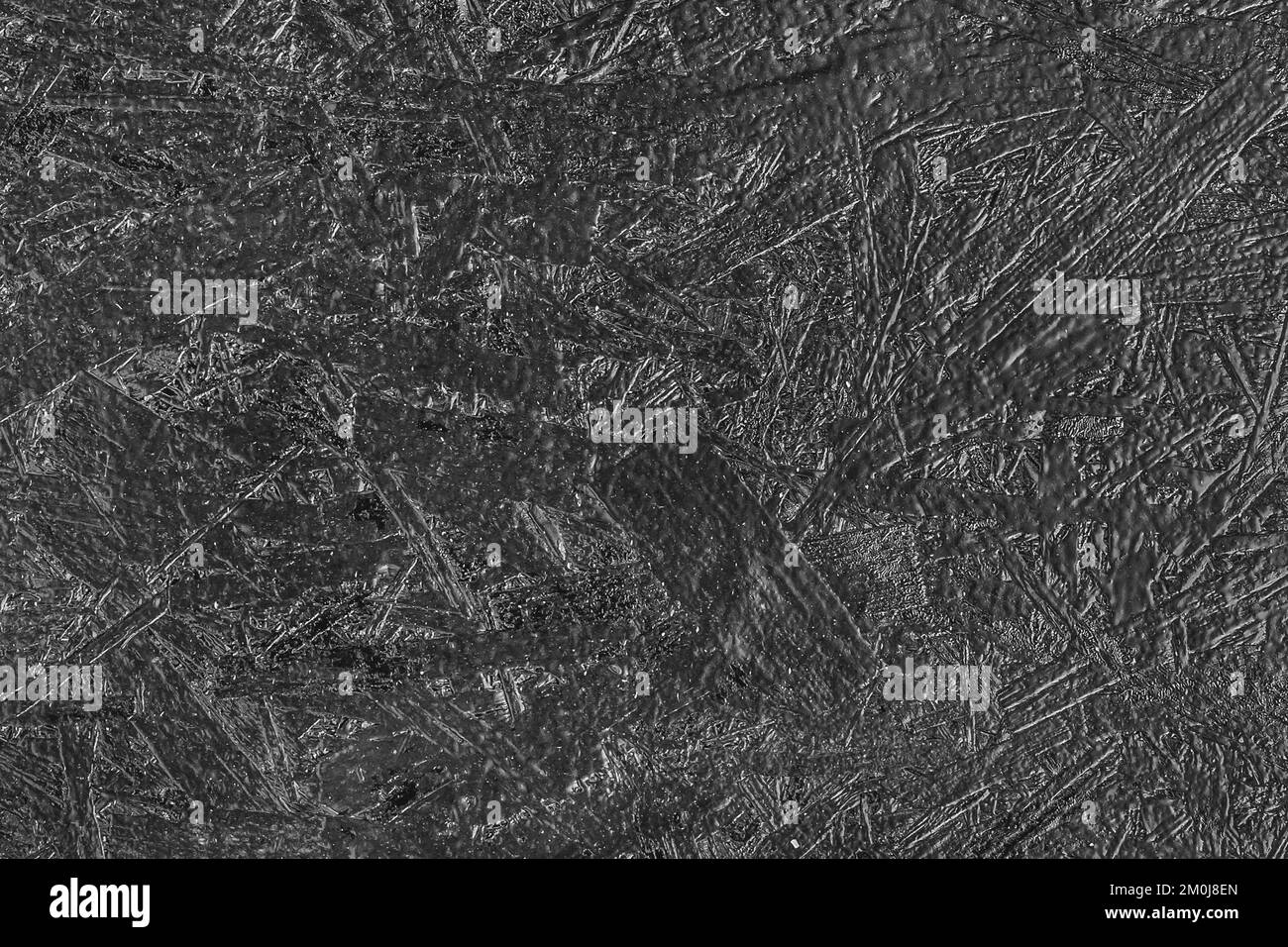 Black paint pressed wood texture, chipboard dark surface pattern ...