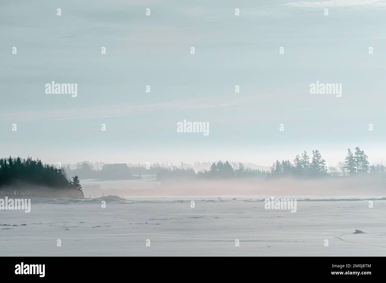 Mist rising from a frozen river Stock Photo - Alamy