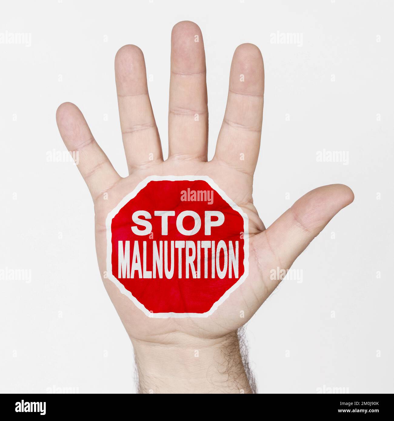 On the palm of the hand there is a stop sign with the inscription ...