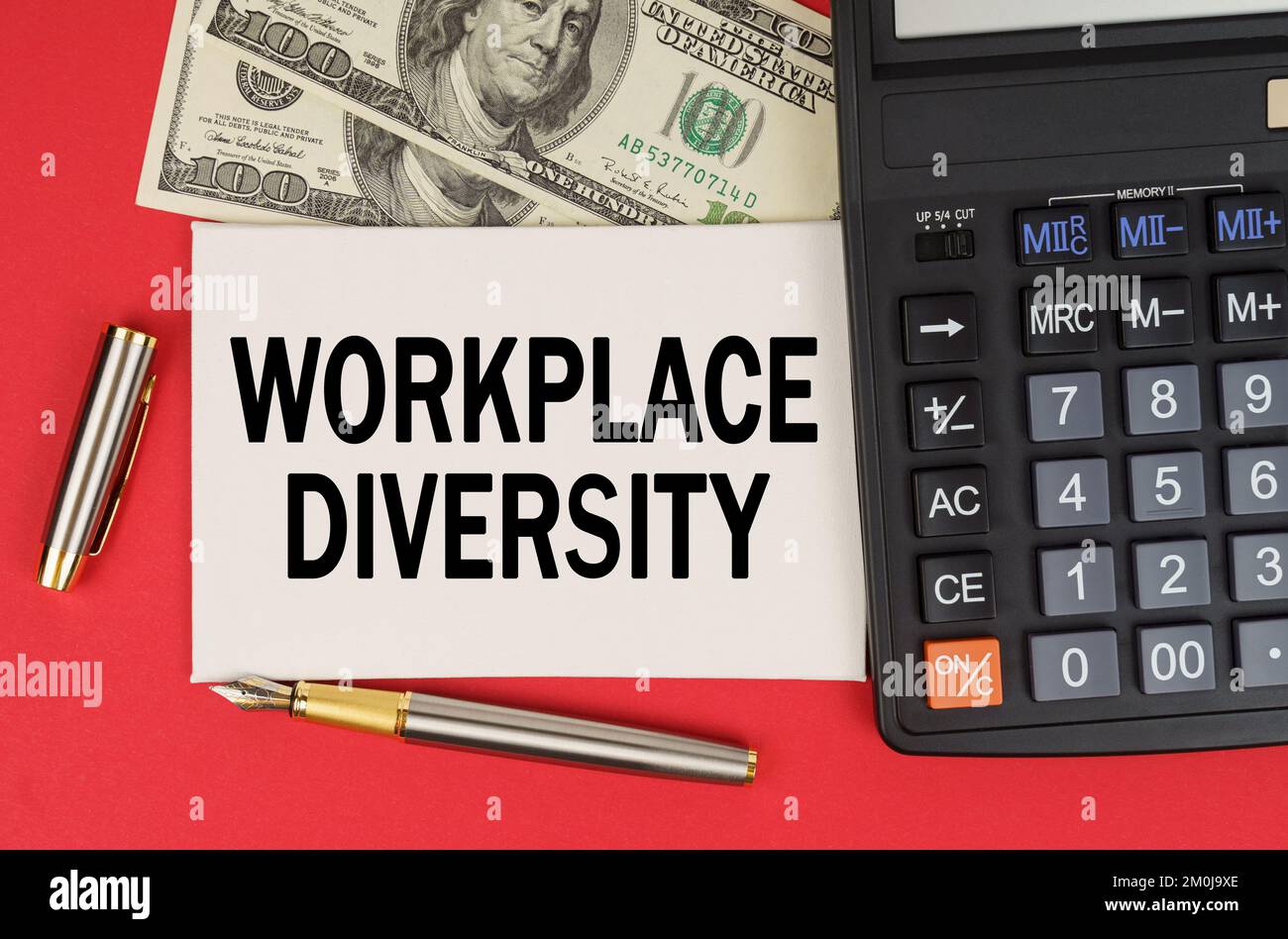 Business and finance concept. On a red background, among the money, a ...