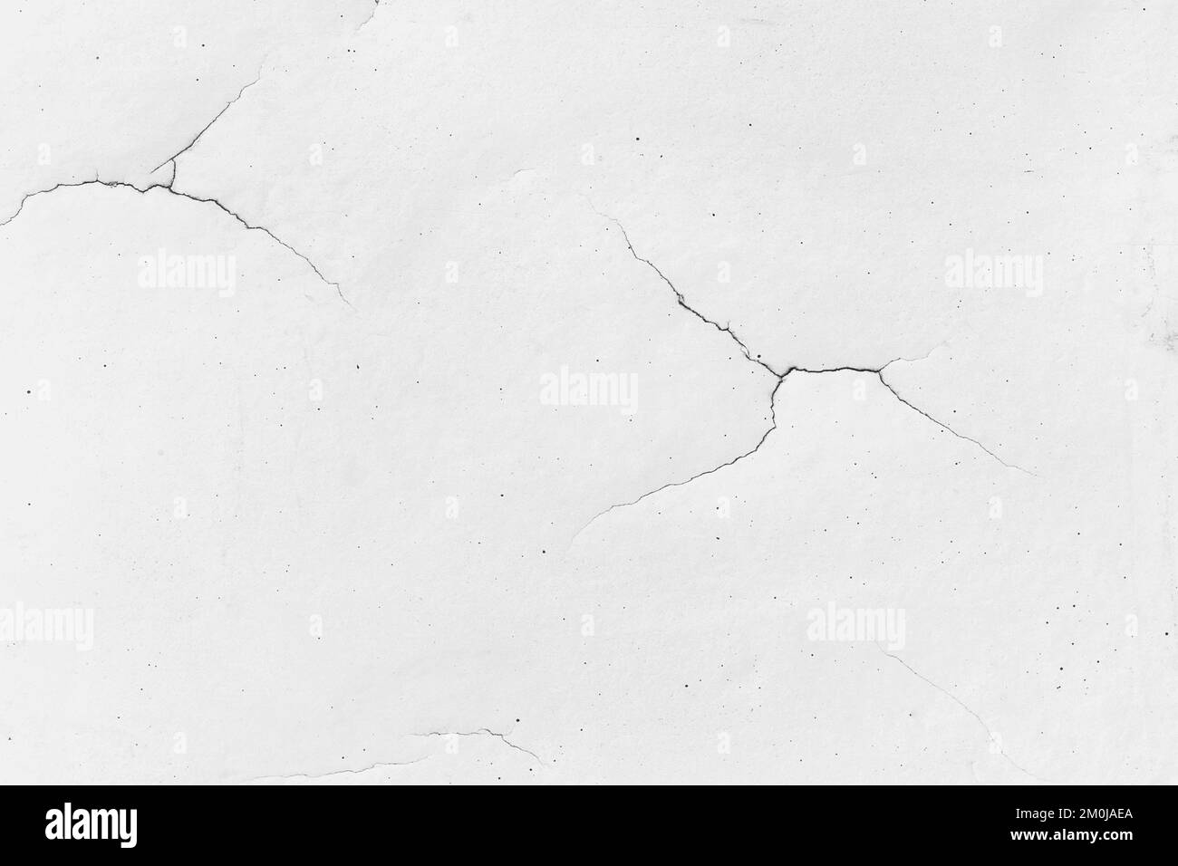 White stucco paint wall with cracks on surface, texture cracked pattern ...