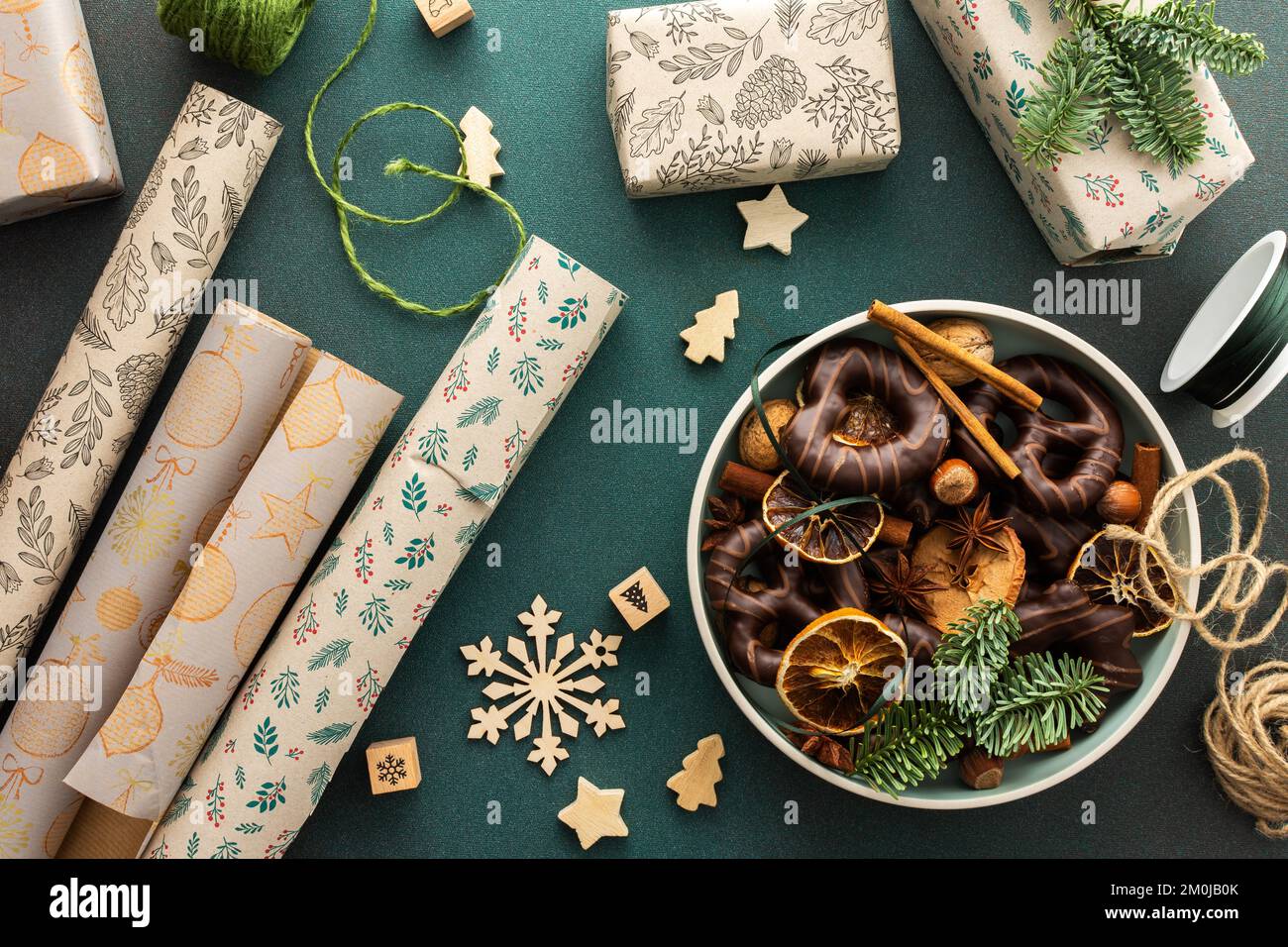 Preparing for the holiday, wrapping gifts under the Christmas tree in ...