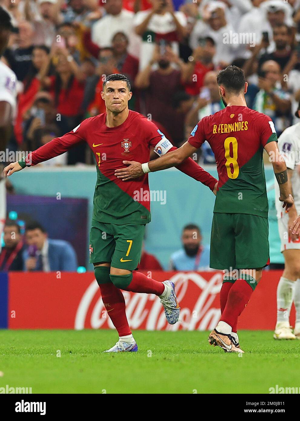 Lusail, Qatar. 6th Dec, 2022. Bruno Fernandes (R) of Portugal reacts with Cristiano Ronaldo of ...